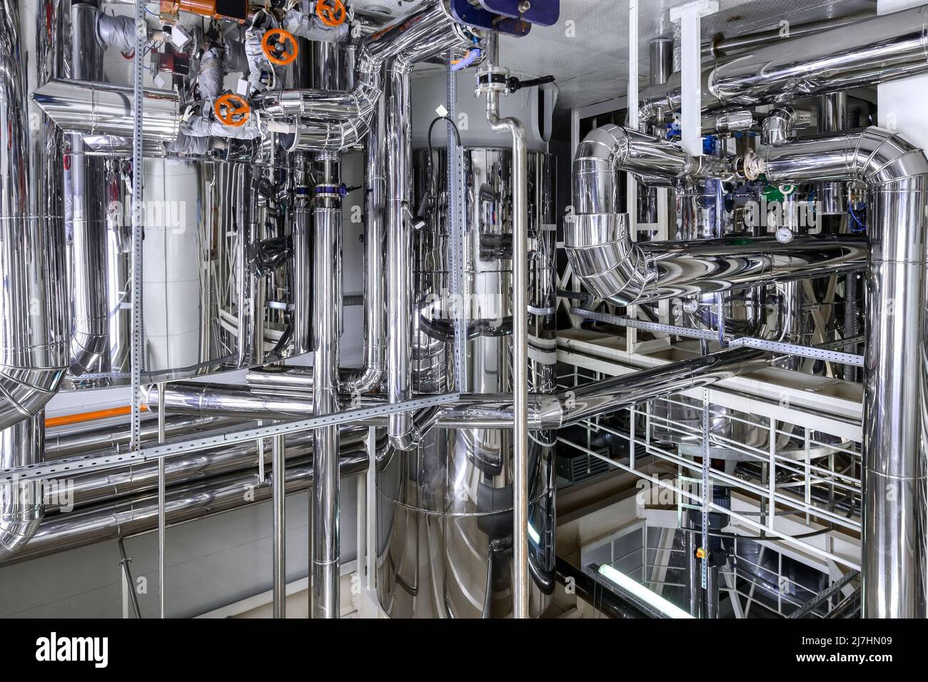 Complicated pipeline system in spacious workshop of plant Stock Photo ...
