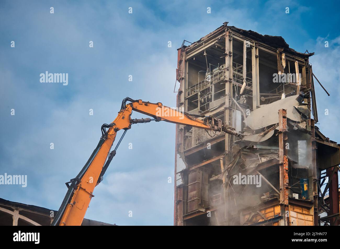 Destroying of old industrial building by excavator destroyer Stock ...