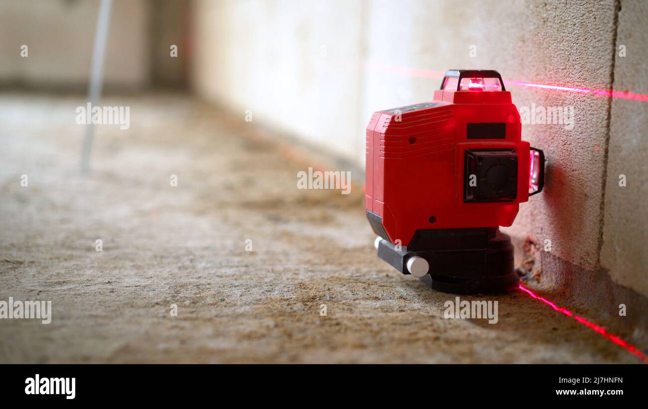 Laser level for wall renovation. Construction laser level on a wall ...