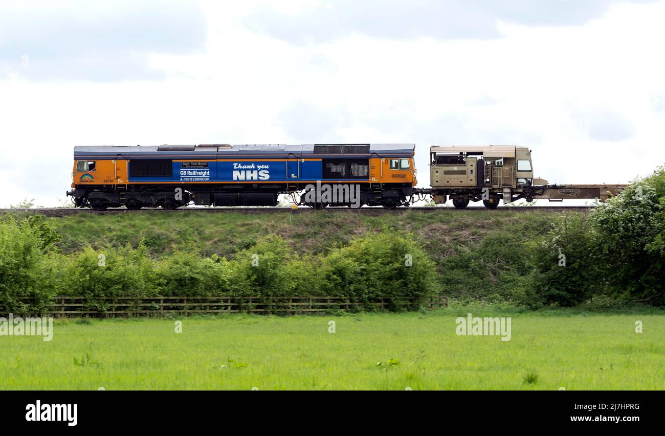 Class 66 diesel locomotive No. 66731 "Capt. Tom Moore" pulling a ...