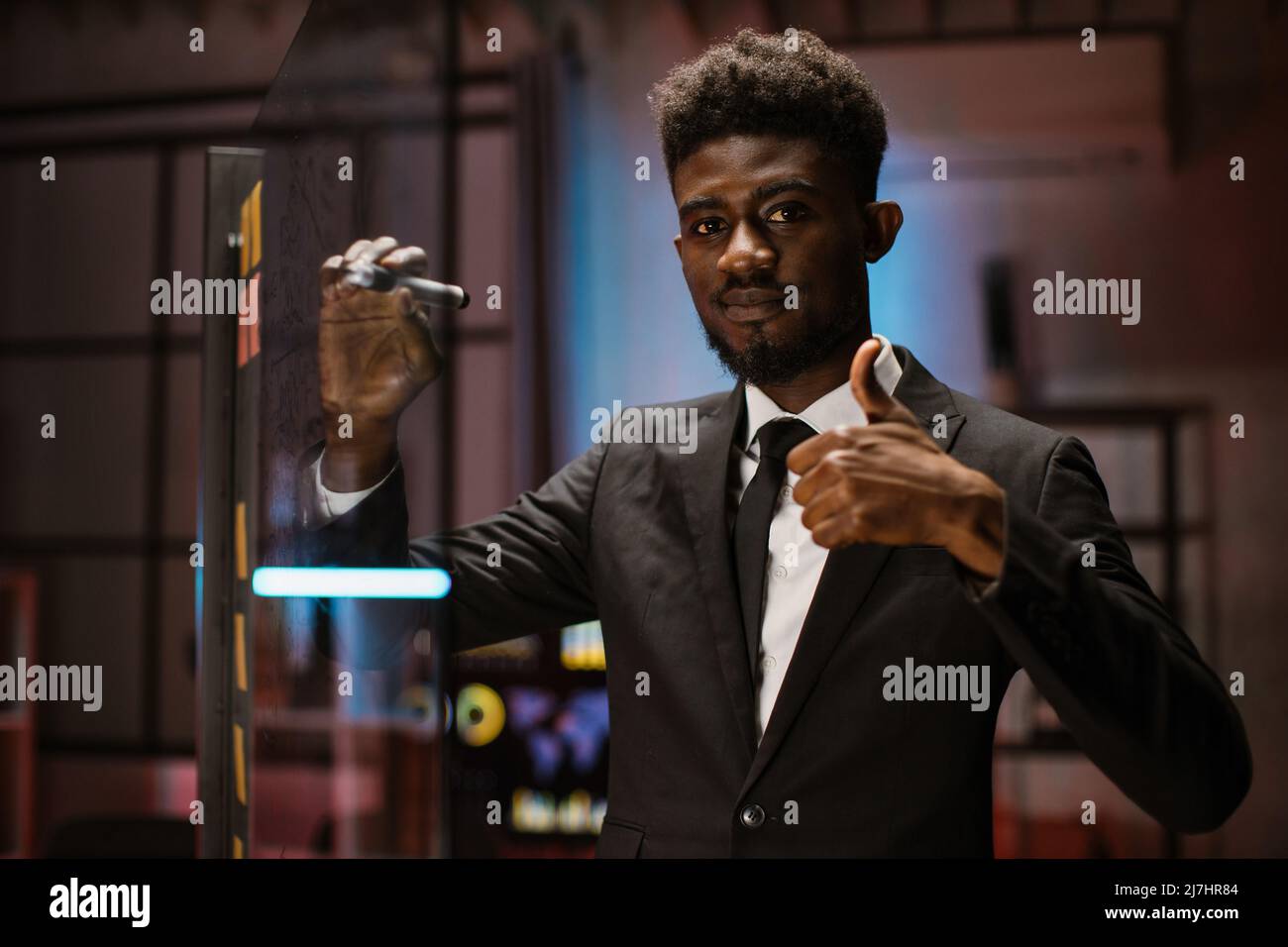 Close up of smart confident African-American businessman looking on ...