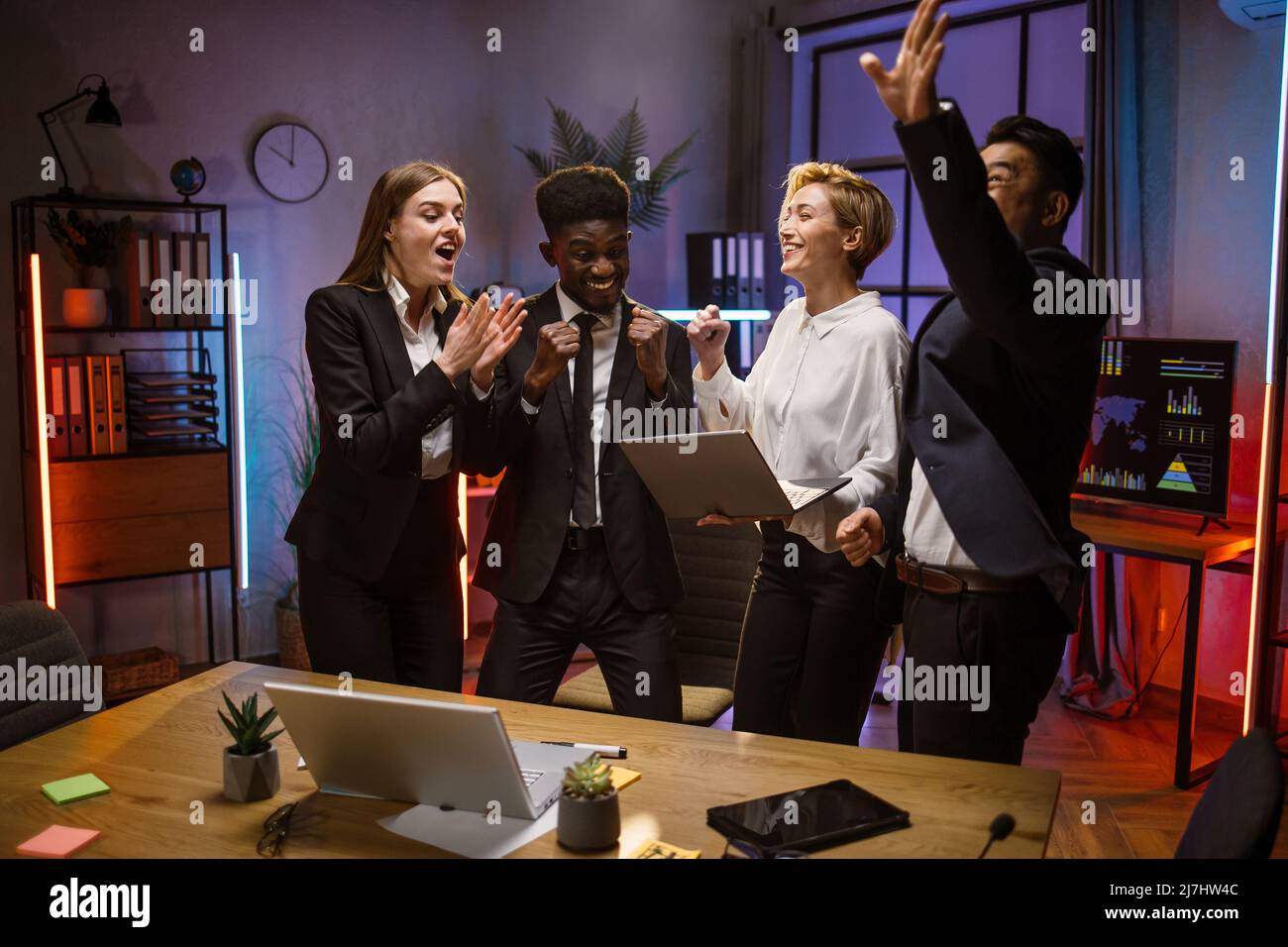 Successful negotiations and cheerful business team. Multiracial four ...