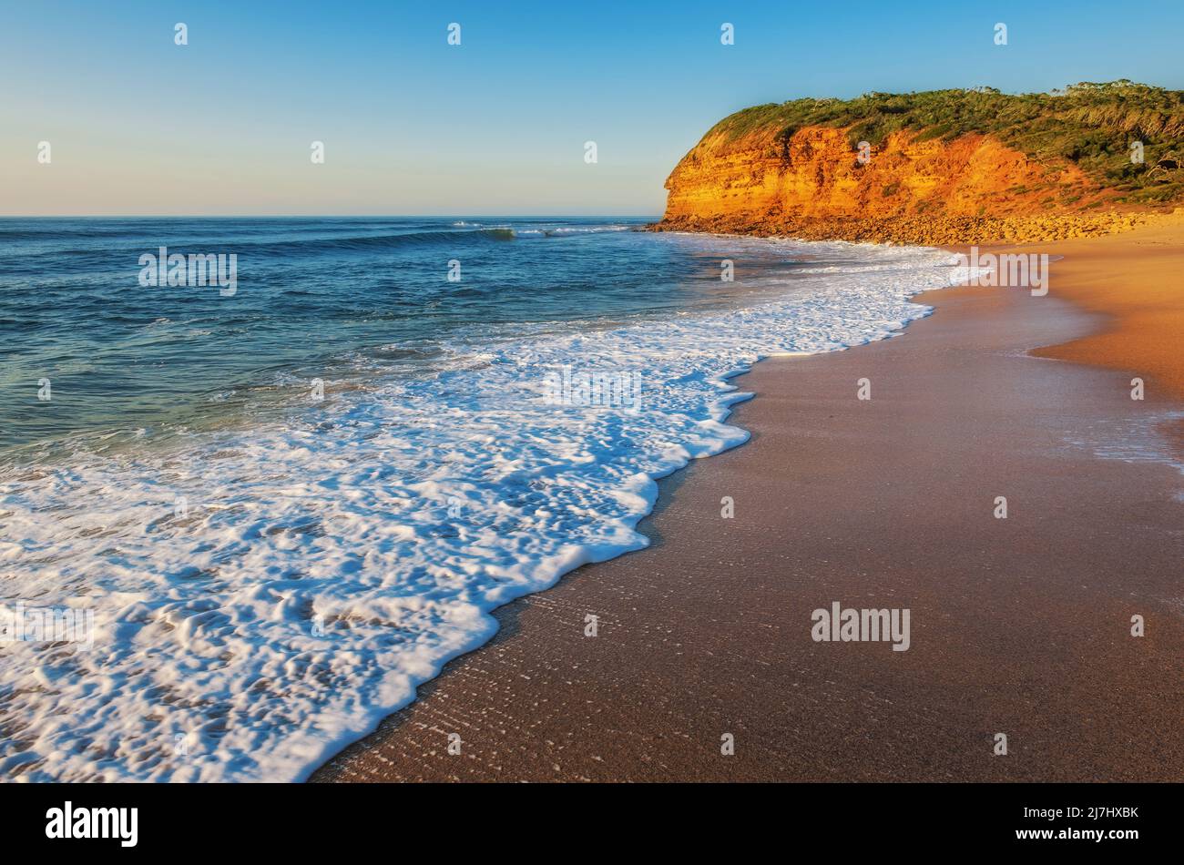 Incoming waves lapping onto the shore at Bells Beach, Torquay, Great ...