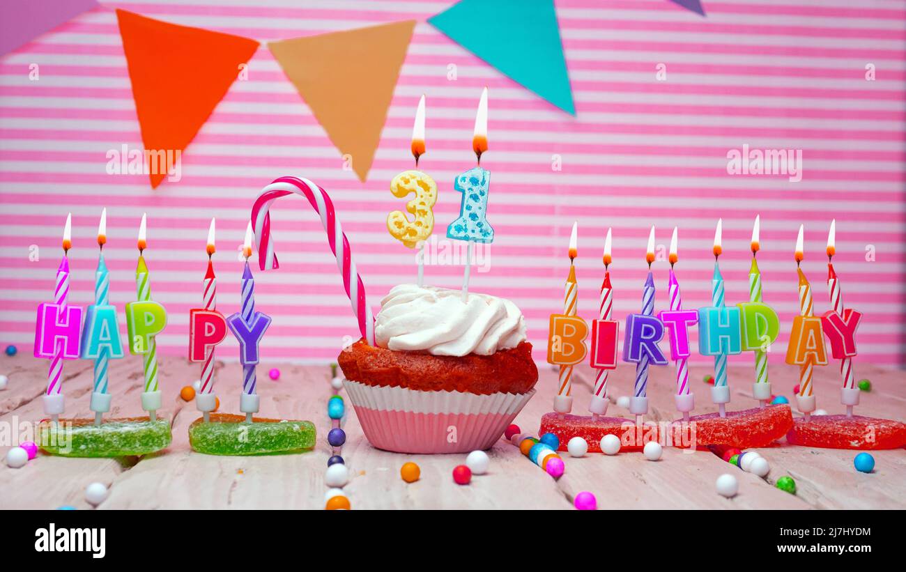 Happy birthday card on a pink background, with a figure in a cupcake ...