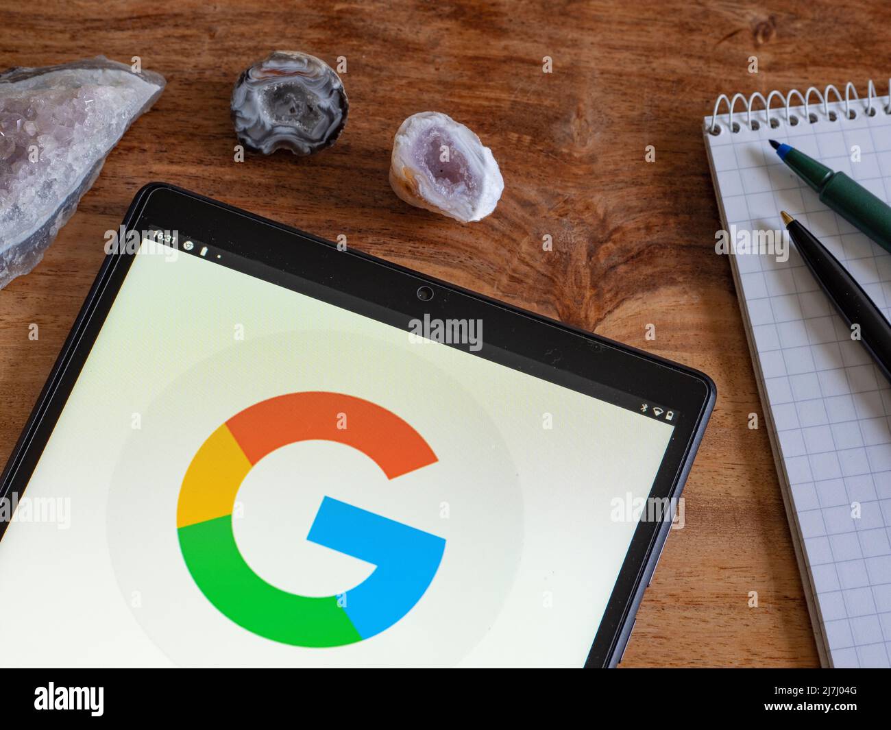In this photo illustration Google logo seen displayed on a tablet ...