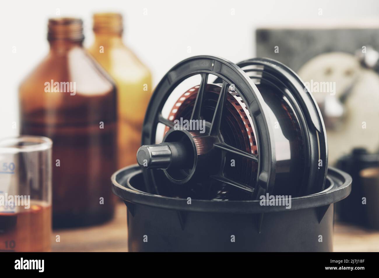 Developing tank with its film reels. Photo film rolls, cassette, timer ...
