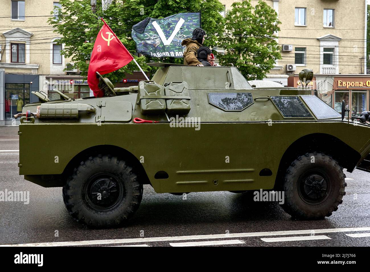 Participants of the rally in an armored car with the Soviet flag and a ...