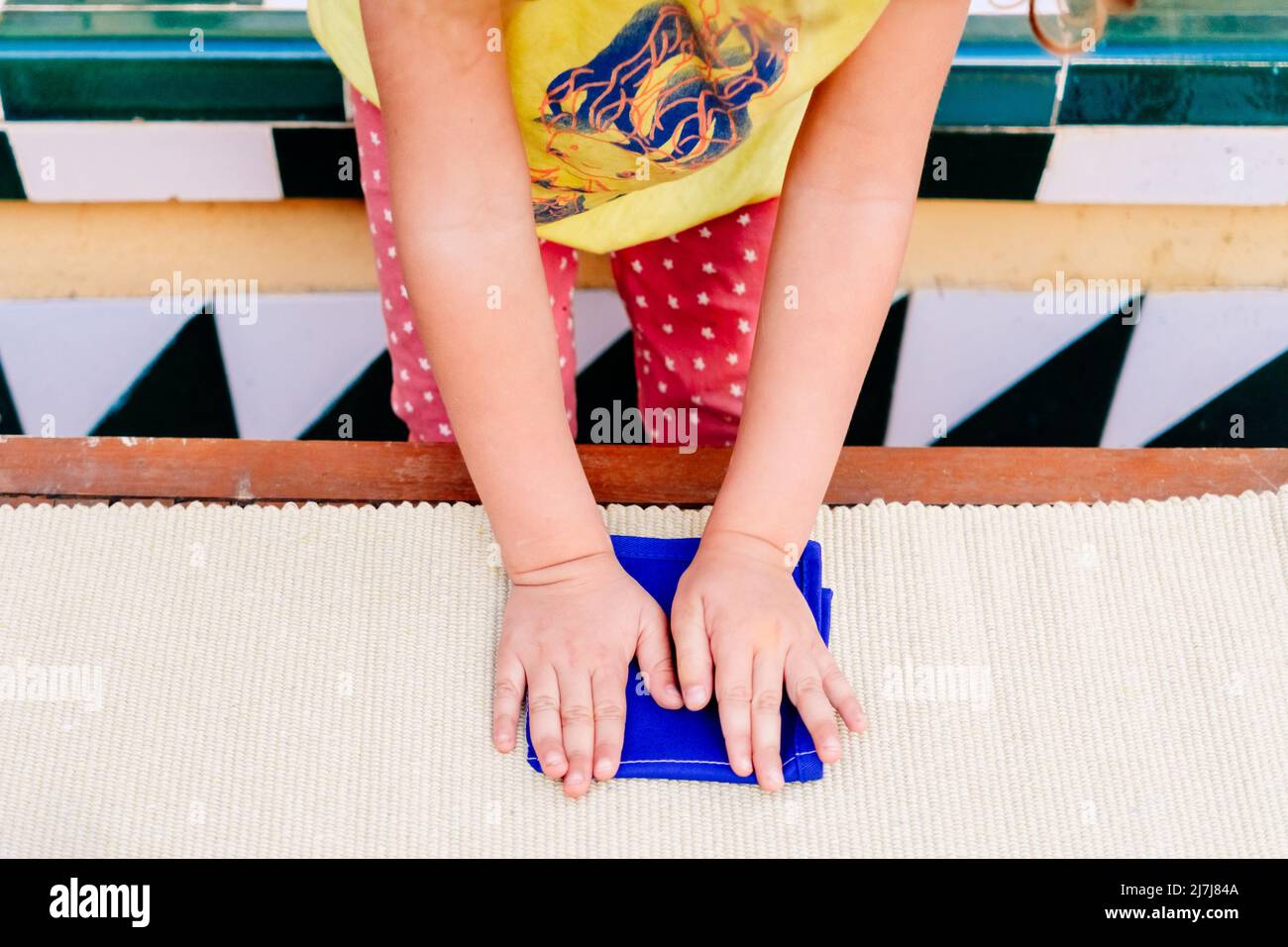 Folding napkins for children is a task to improve the fine motor skills ...