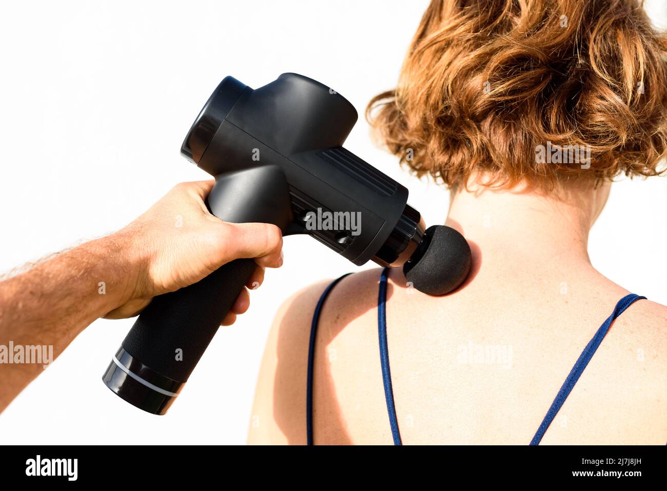 Hand held massage gun hi-res stock photography and images - Alamy