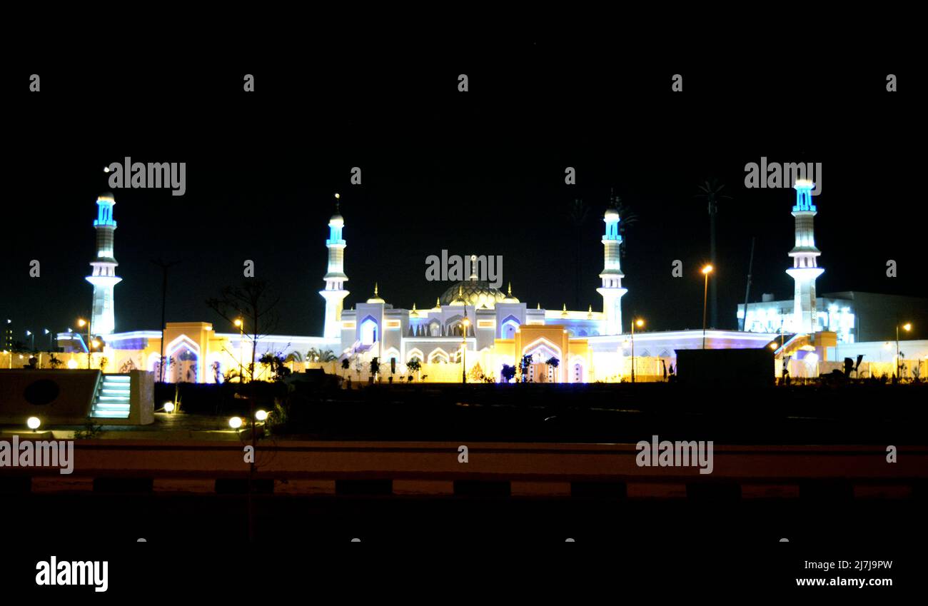 Night scene of a grand mosque in Cairo Egypt with multiple domes and ...