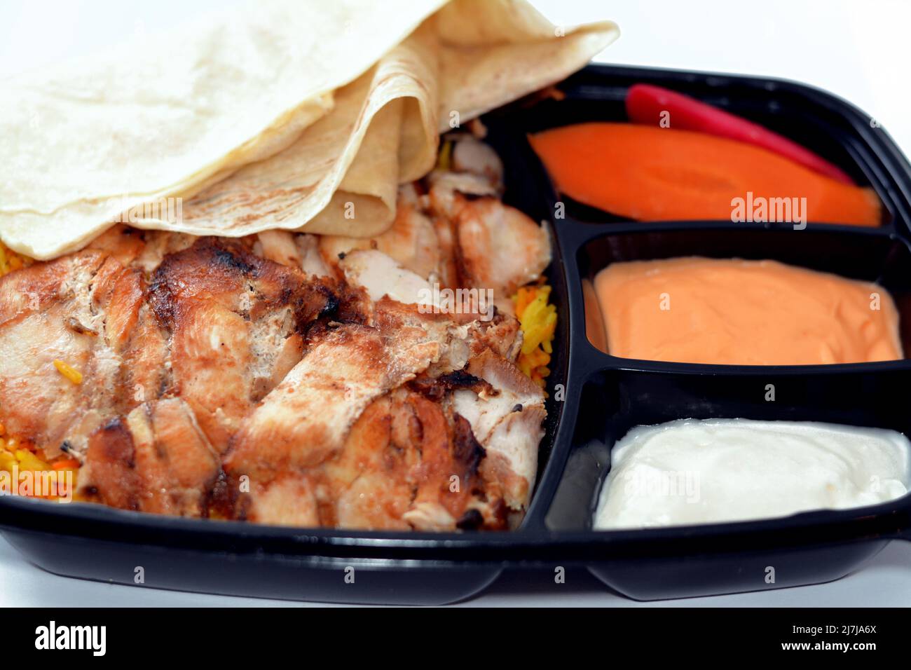 Arabic Syrian cuisine of Chicken Shawarma Fatteh colorful Basmati rice ...