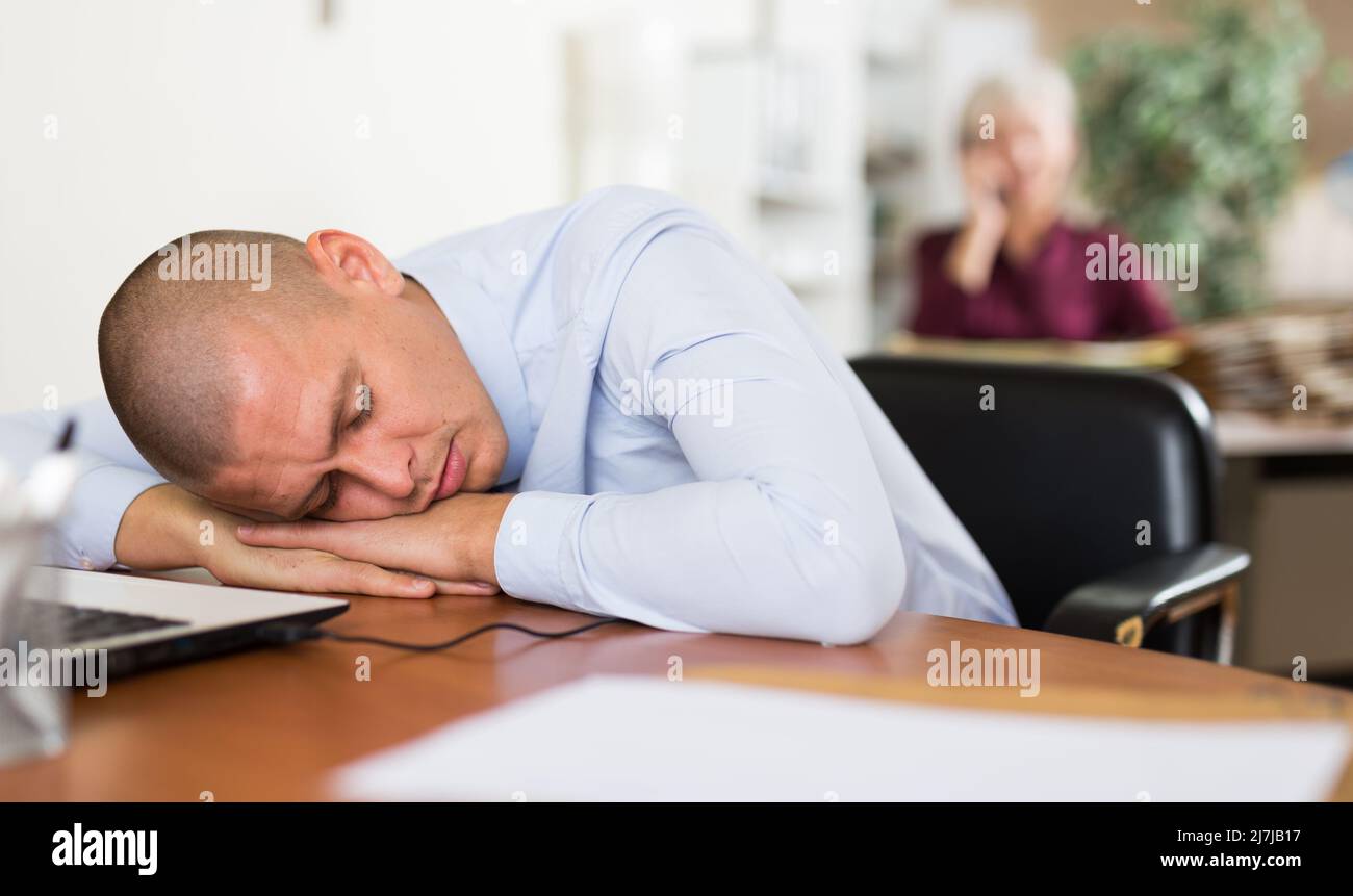 Man resting head on table hi-res stock photography and images - Alamy
