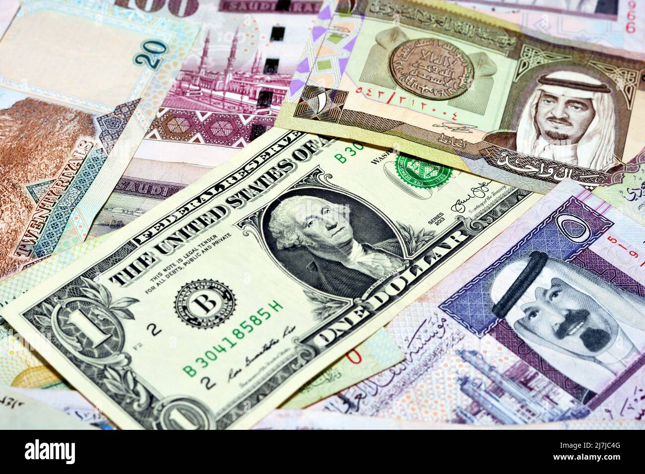Saudi Arabia riyals money banknotes with American dollars banknotes ...
