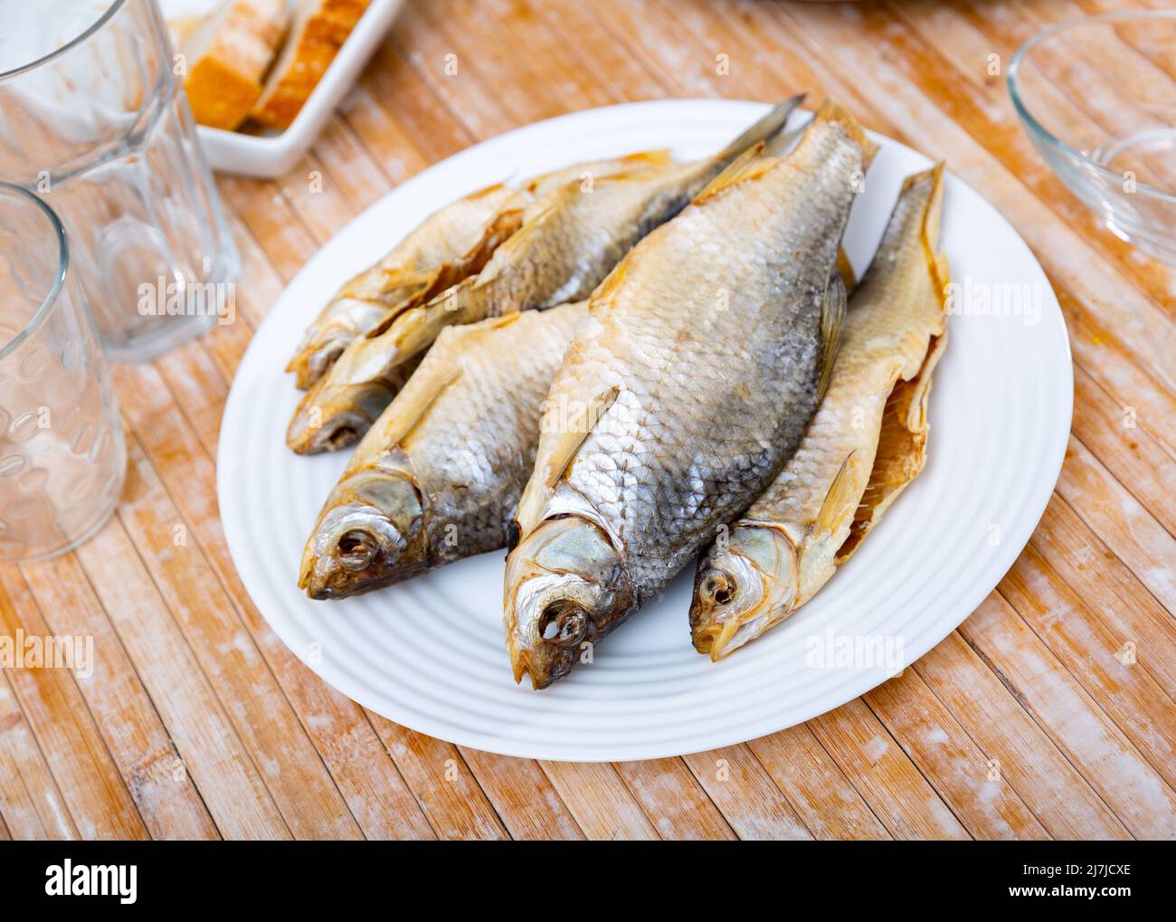Pile of eviscerated dried roaches on plate Stock Photo - Alamy