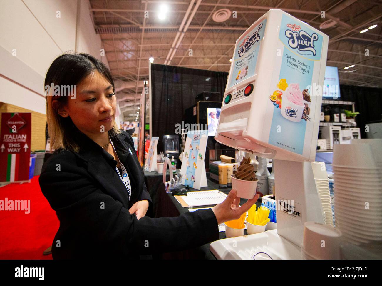 Toronto, Canada. 9th May, 2022. An exhibitor makes frozen yogurt during ...
