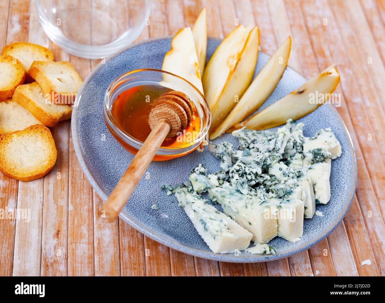 Spanish soft blue roncari cheese with toasted bread, pear and honey ...