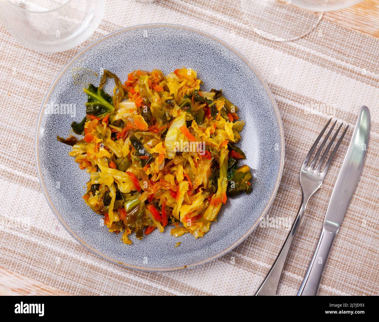 Portion of stewed cabbage on table Stock Photo - Alamy