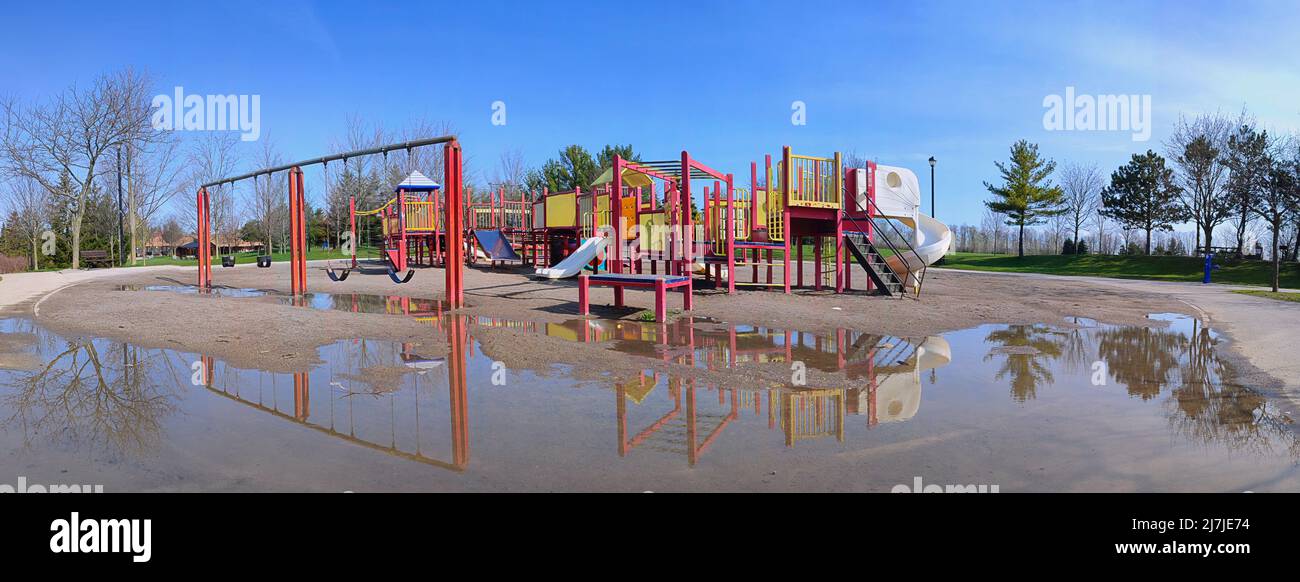 Panoramic view of the playground with reflection at the public park in ...