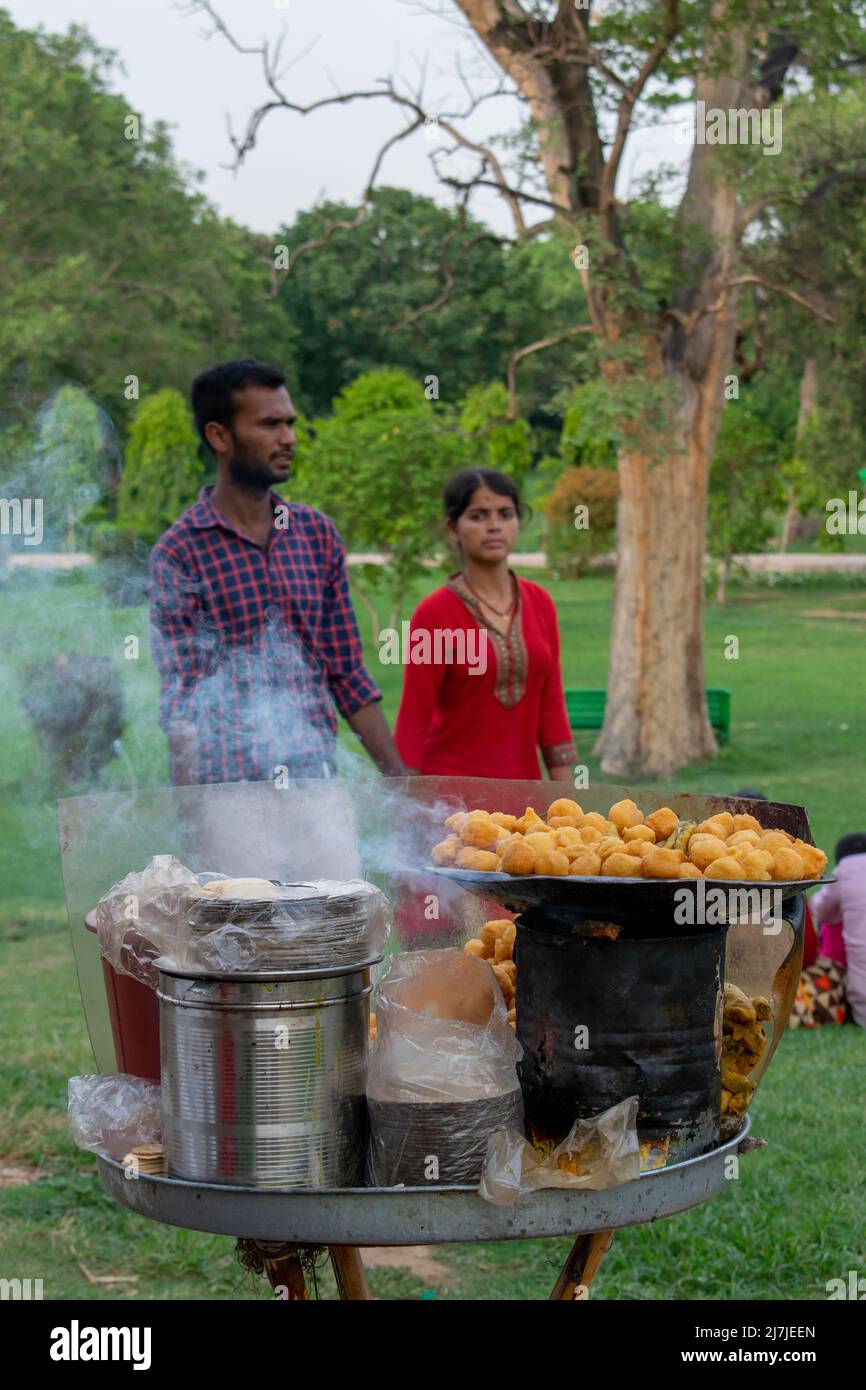 An Indian man is making street food outdoor Stock Photo - Alamy