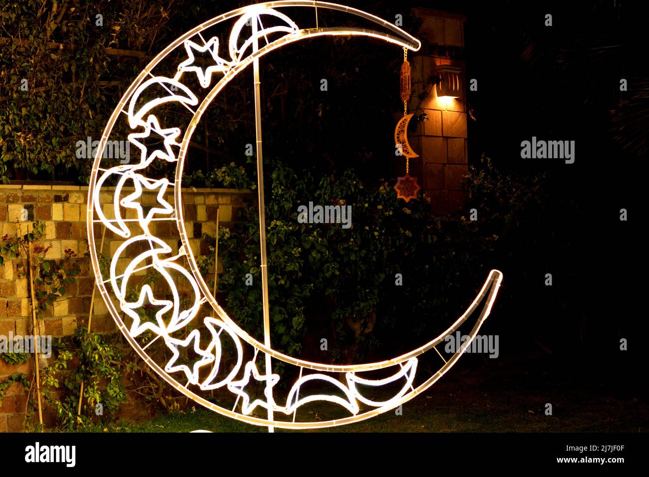 A crescent made with led lights having multiple stars and crescents in ...