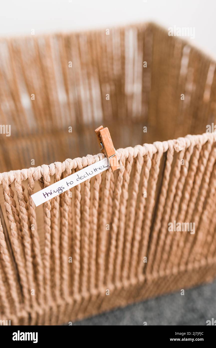 storage basket with Things to Declutter label on it and nothing inside ...