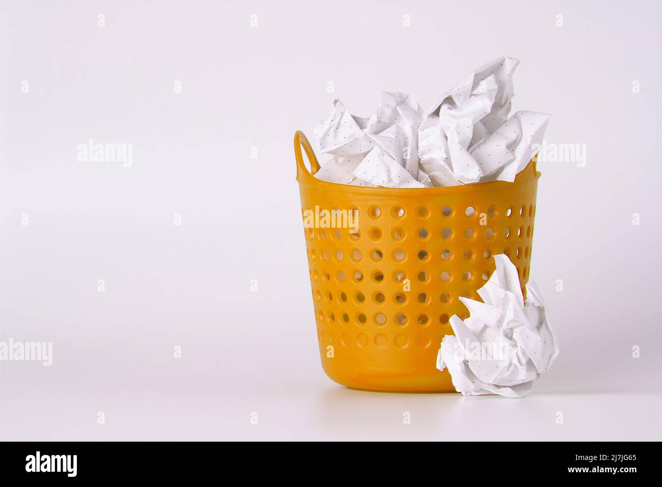 Trash can. Full basket. Crumpled paper in a basket. A mountain of ...