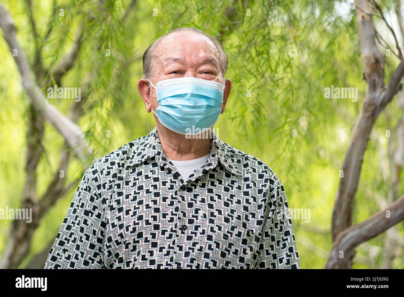 Asian senior man, Chinese ethnicity. Wearing medical face mask ...