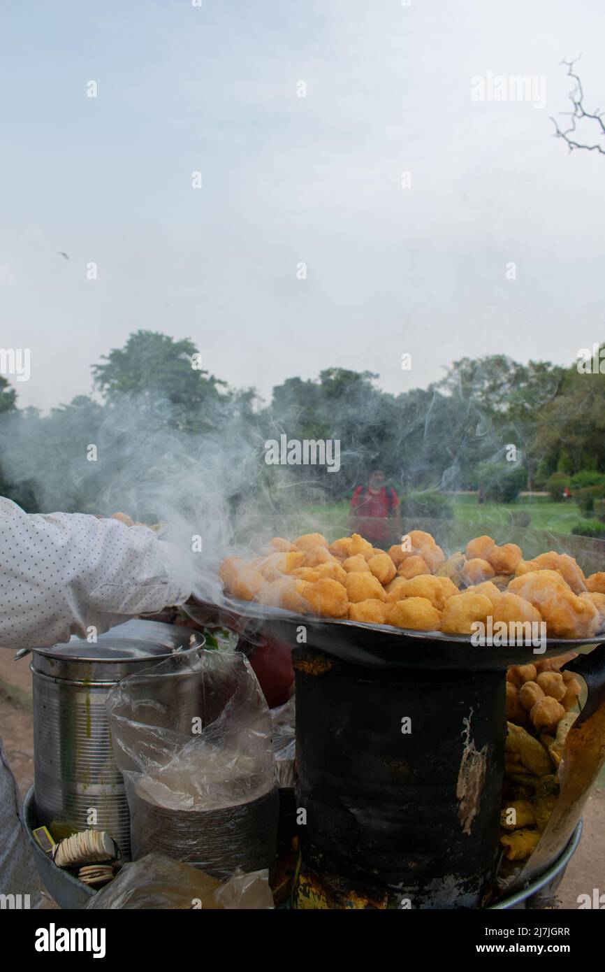An Indian man is making street food outdoor Stock Photo - Alamy