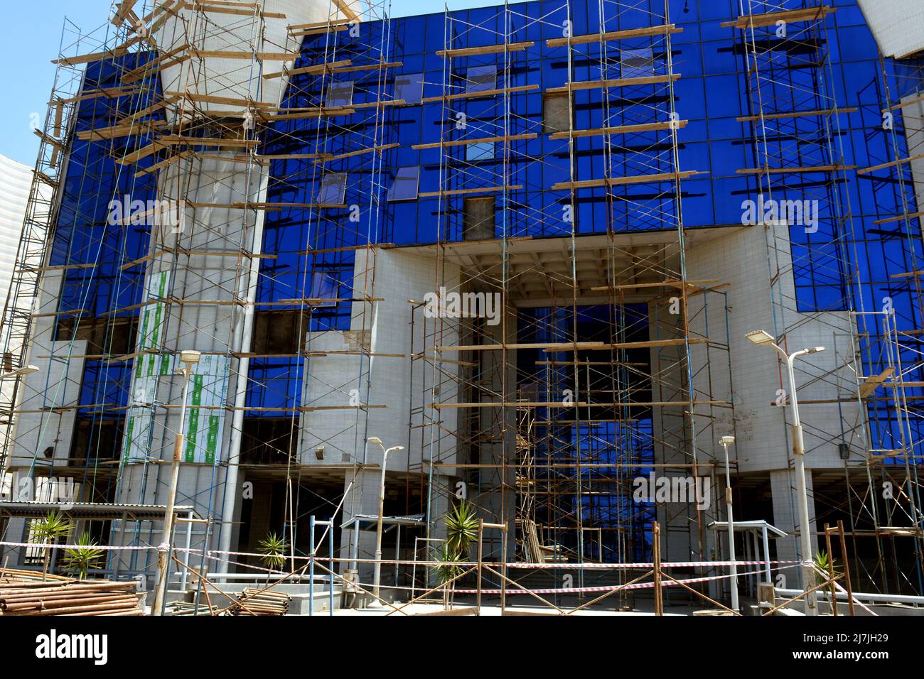 Cairo, Egypt, July 1 2021: A blue building renovation and installation ...