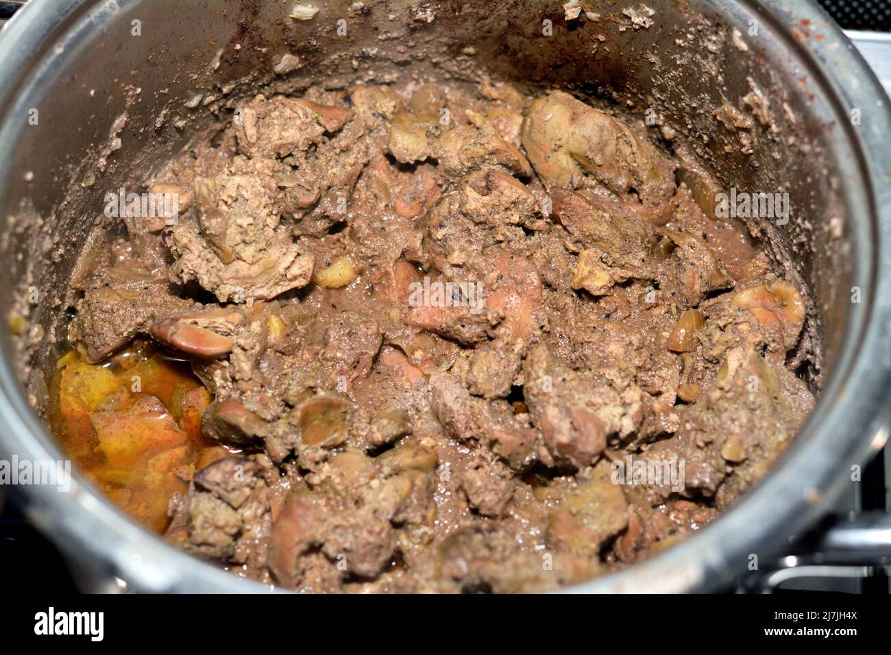 Grilled chicken liver sliced in pieces cooked with oil, white vinegar ...