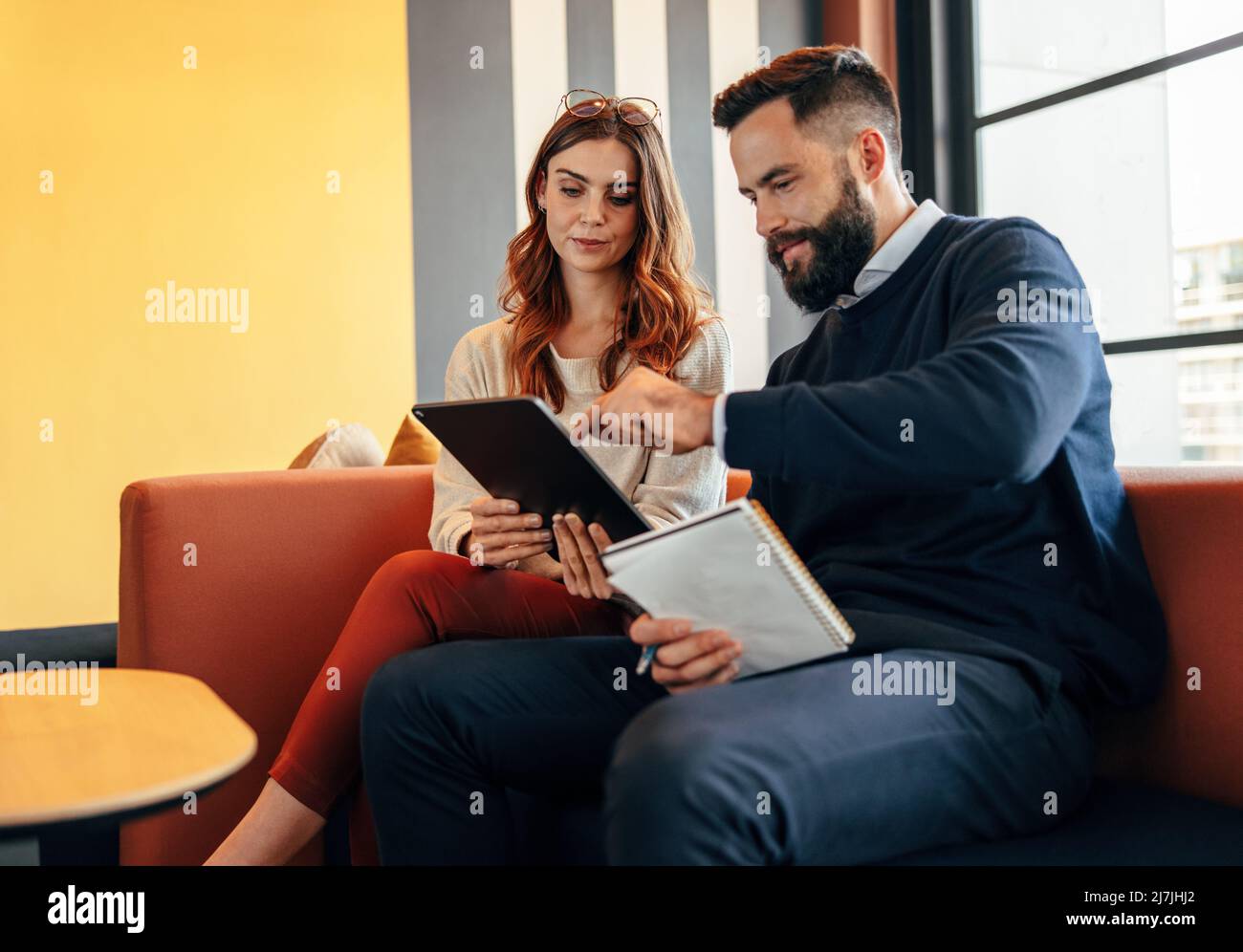 Female office administrator using digital hi-res stock photography and ...