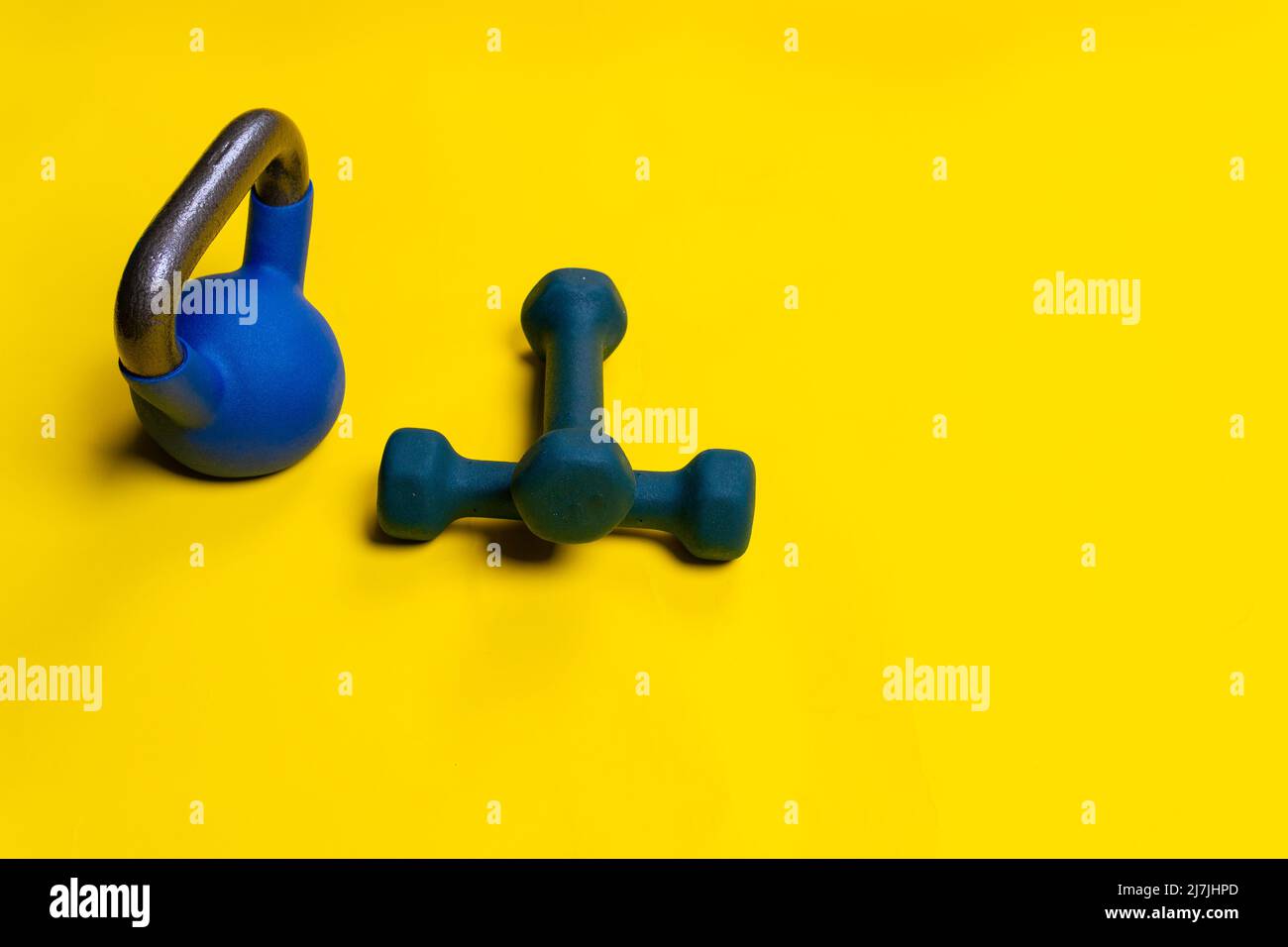 Kettlebell blue yellow isolated space ackground fitness fit object ...