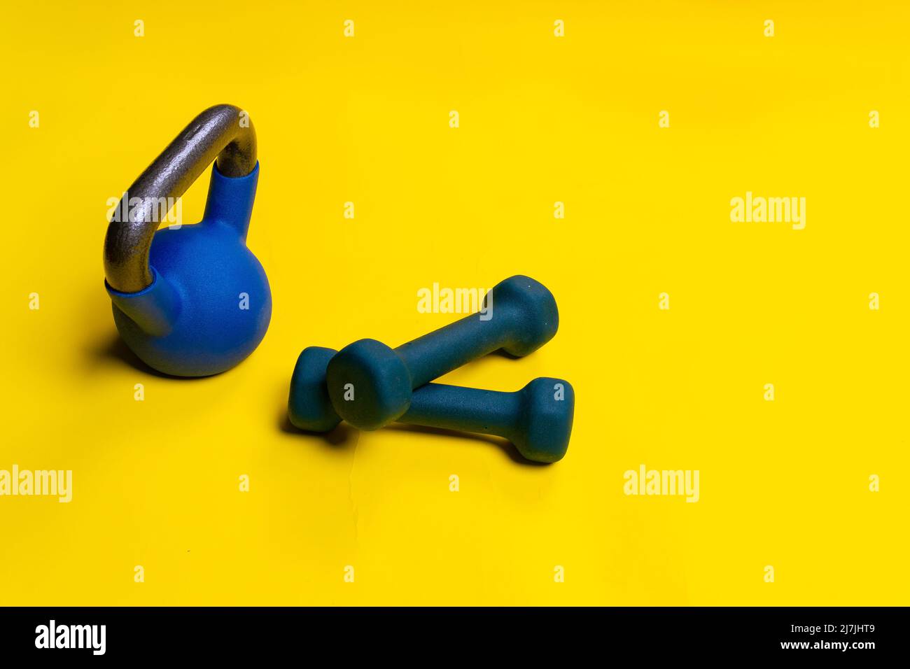 Yellow blue isolated space kettlebell ackground fitness iron object ...