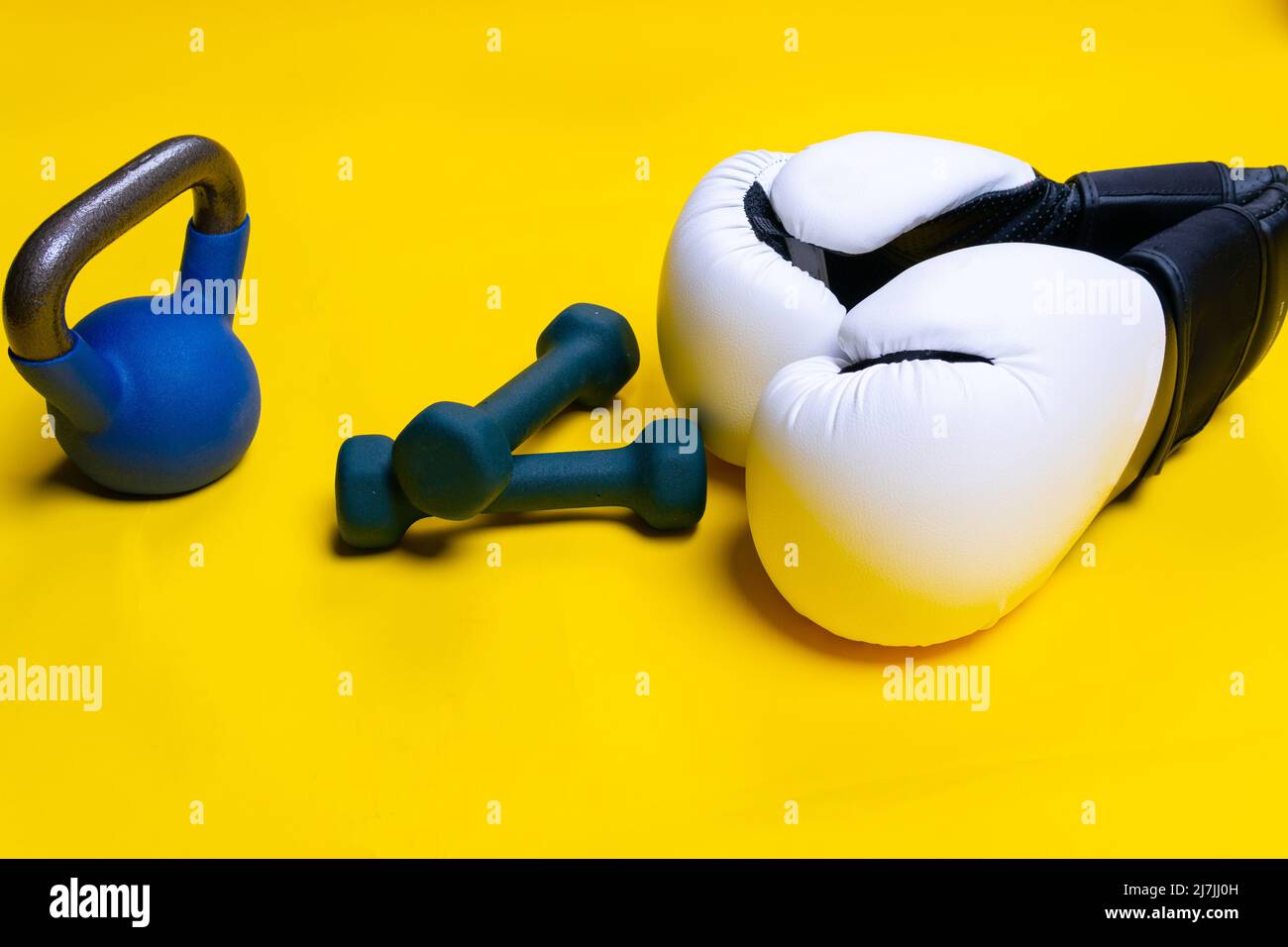 Isolated kettlebell yellow space blue ackground fitness object ...