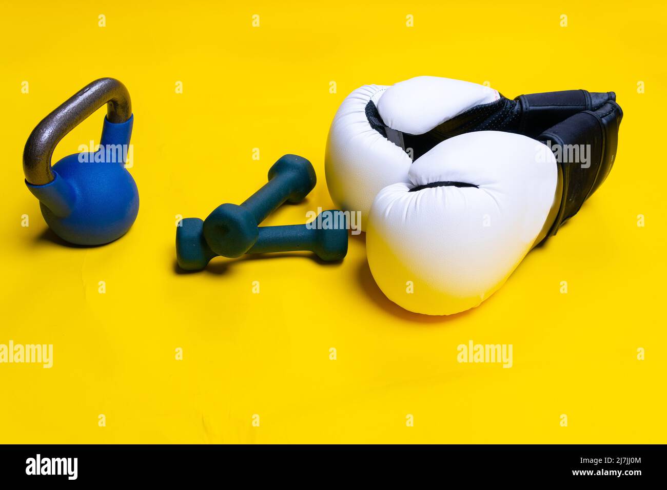 Space isolated kettlebell blue yellow ackground fitness cast ...