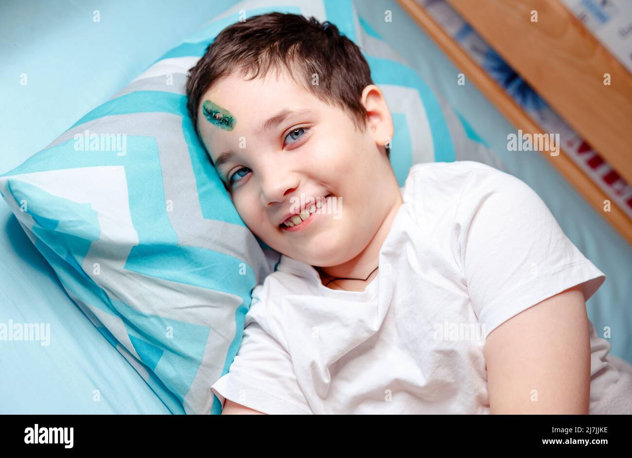 Child is happy because he is being discharged from the hospital room ...