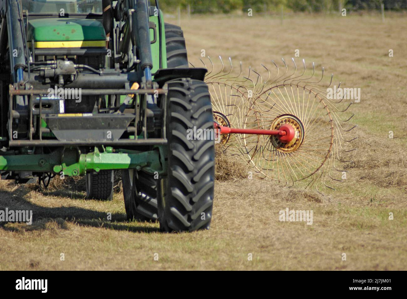 Farmer Harvesting cutting hay in Florida FL and bailing it to cubes ...