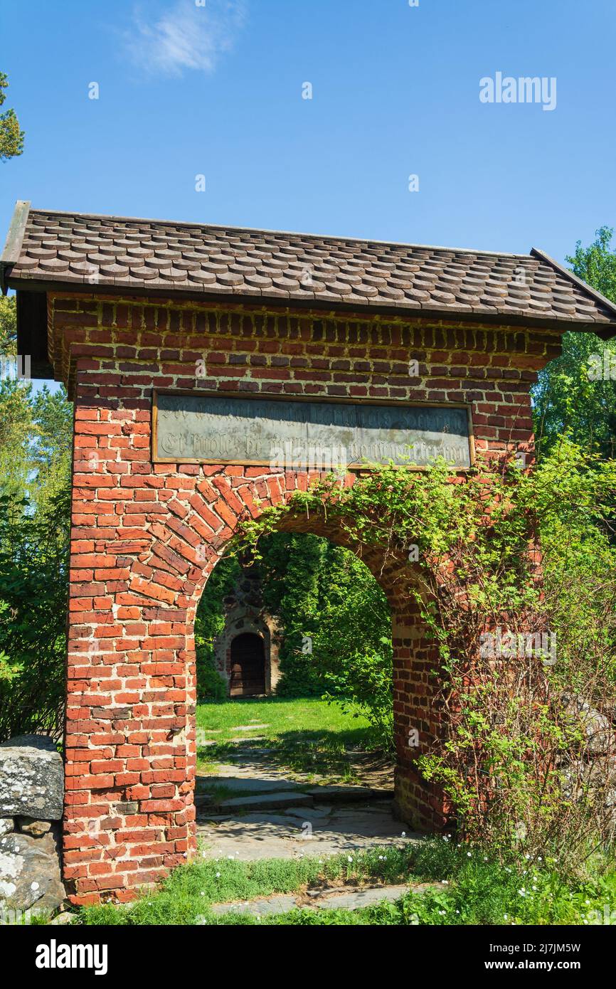 Red brick gate with a bronze palque to church in Lepaa Finland Stock ...