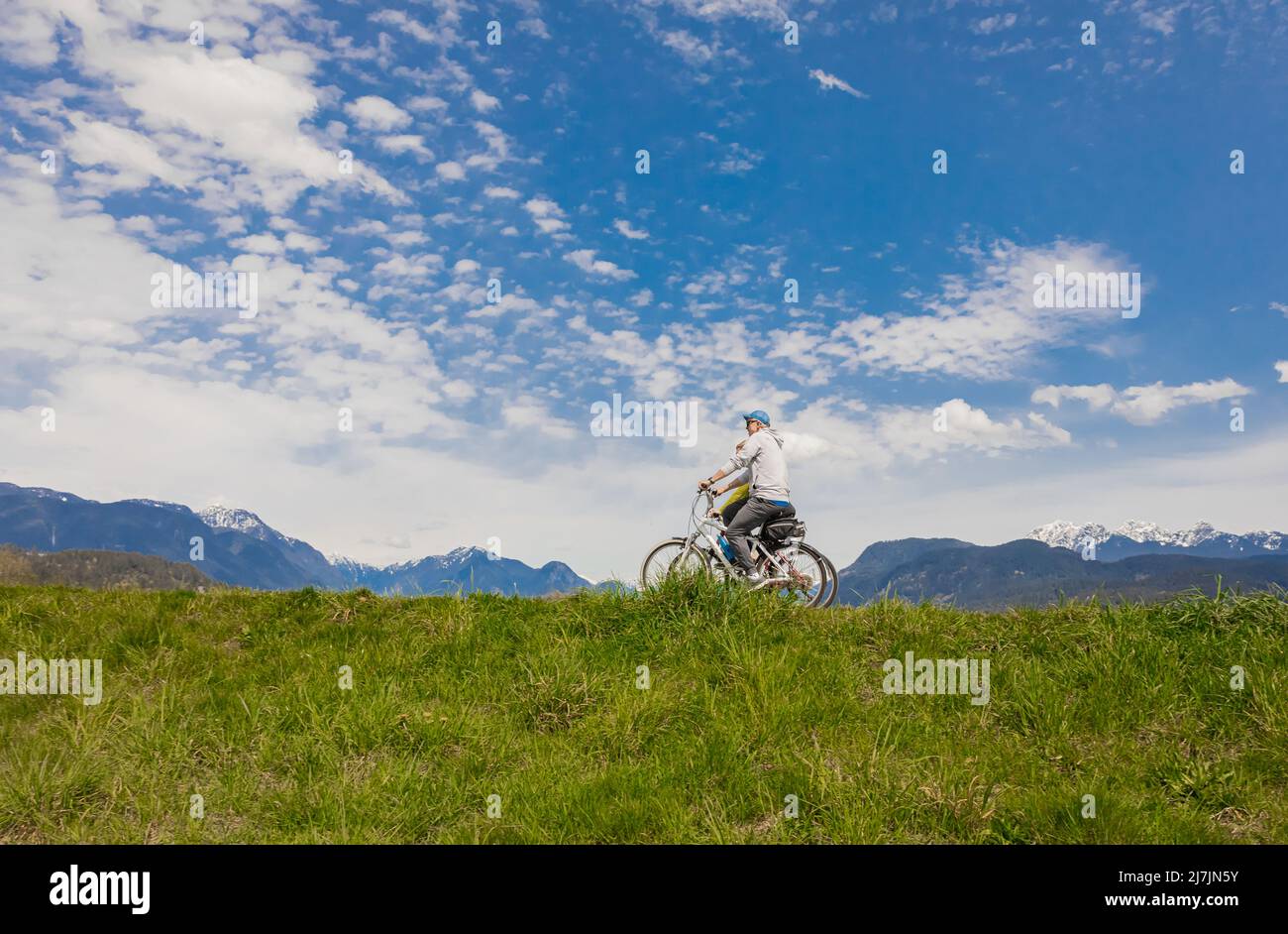 Elderly man riding bicycle bike ride exercise park cycle hi-res stock ...