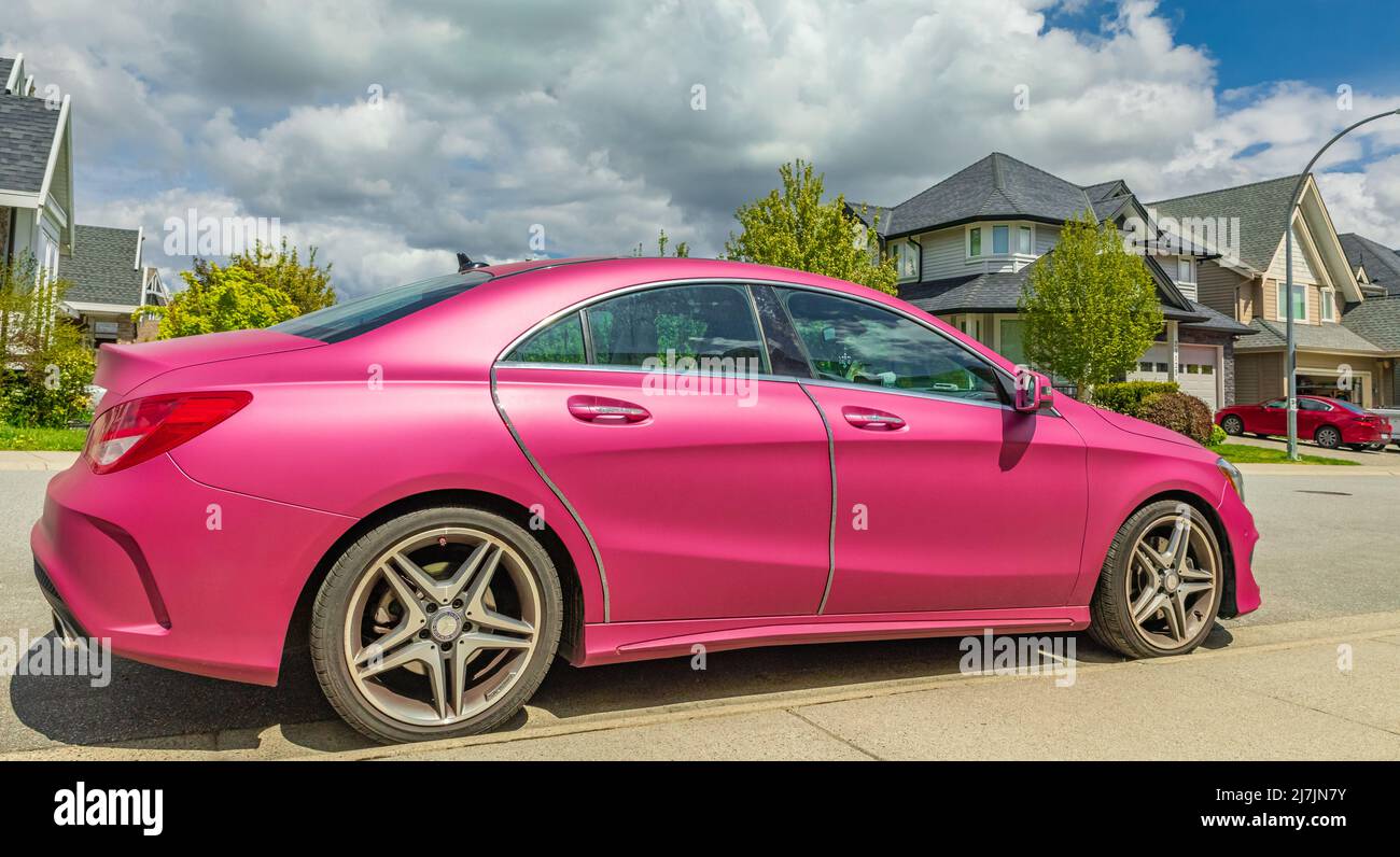 Luxury Mercedes Benz CLA Class car with futuristic design in pink color ...