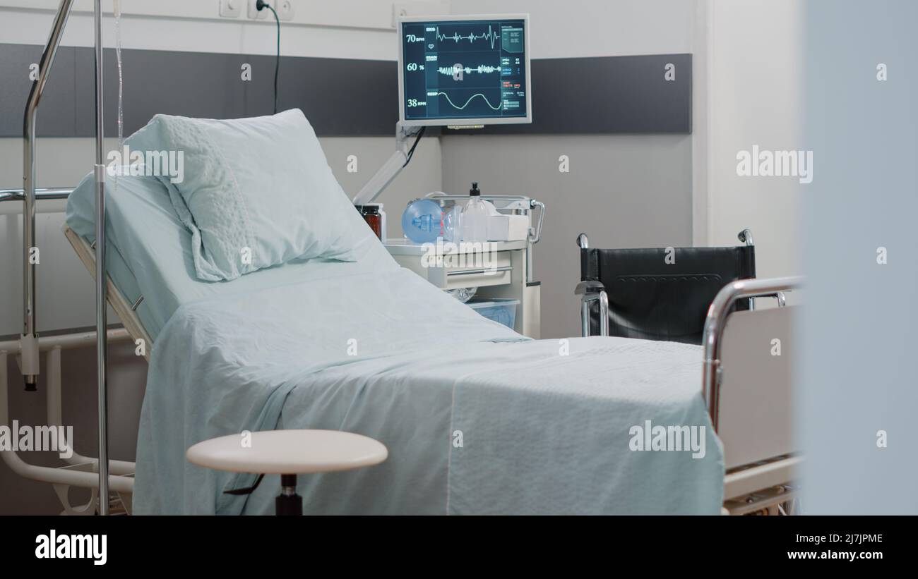 Nobody in hospital ward bed with medical equipment and heart rate ...