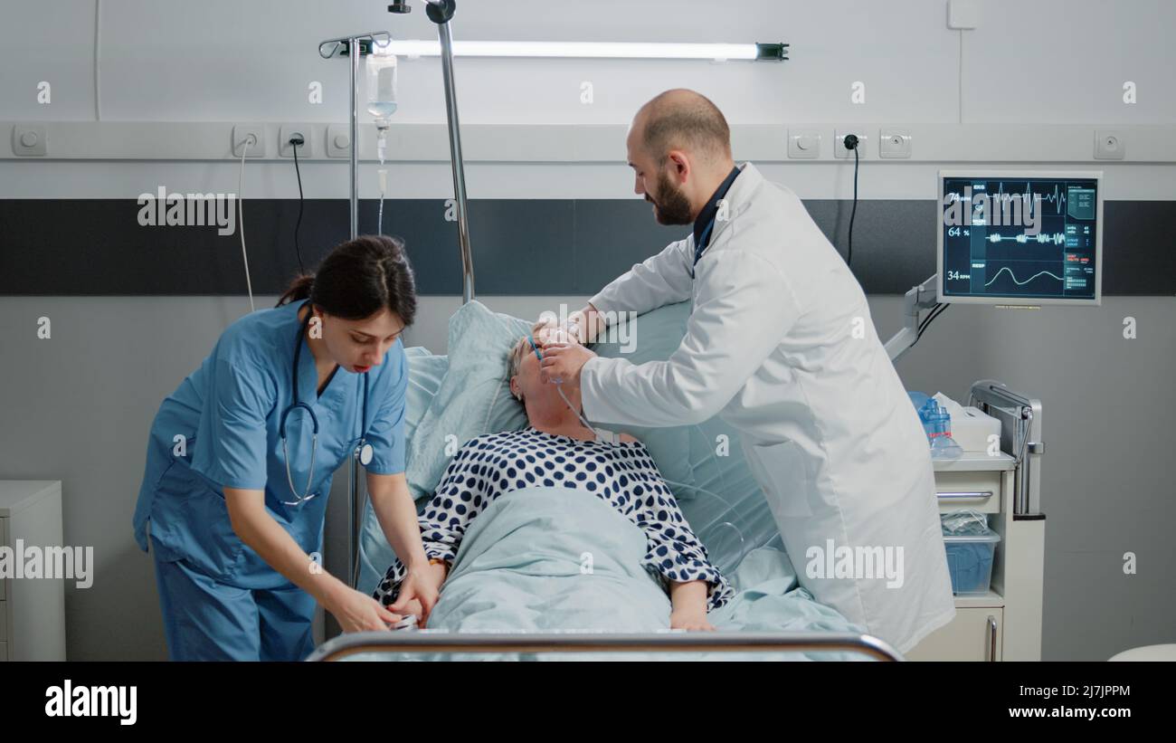 Medical team rushing to help patient with respiratory problem in ...