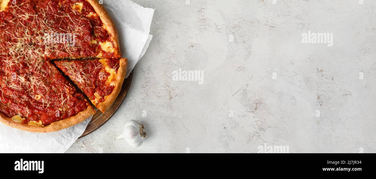 Tasty Chicago-style pizza on grunge background with space for text ...