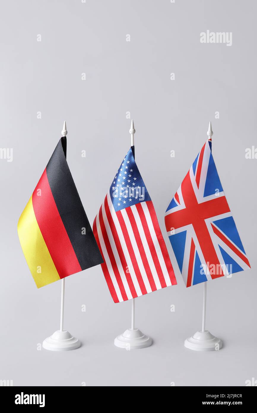 Flags of Germany, USA and Great Britain on grey background Stock Photo ...
