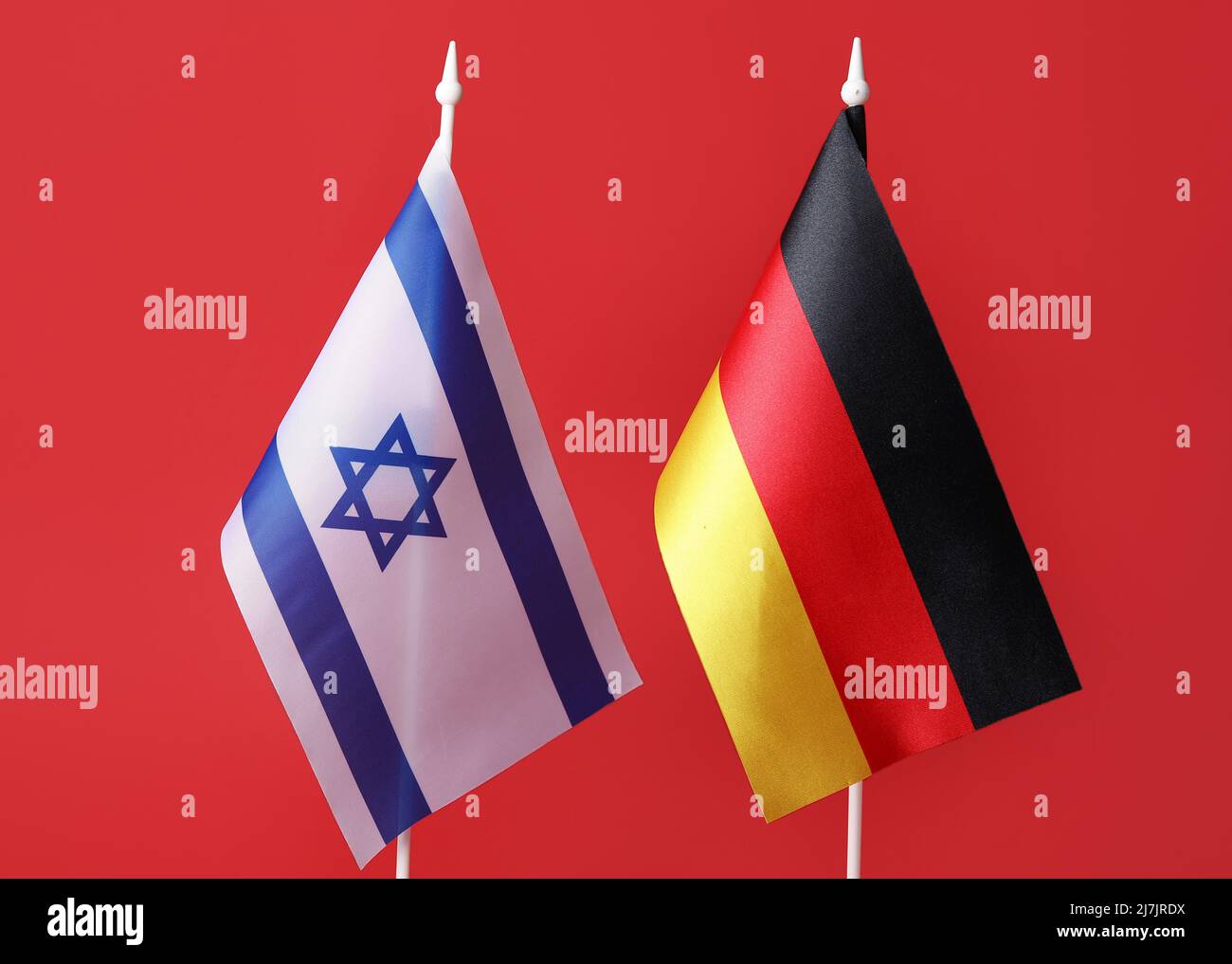 Flags of Israel and Germany on red background, closeup Stock Photo - Alamy