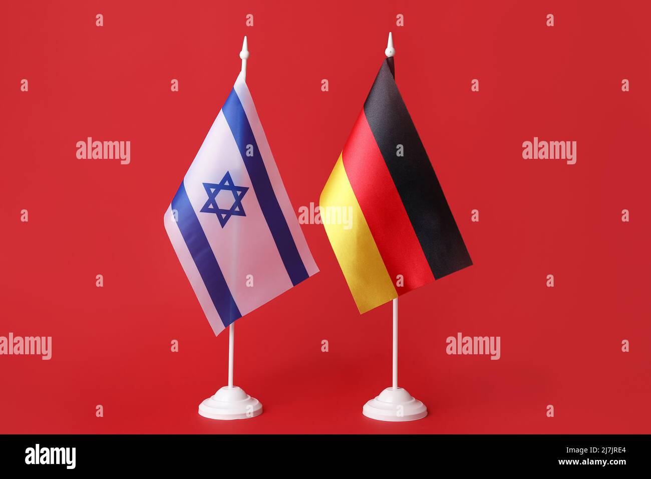 Flags of Israel and Germany on red background Stock Photo - Alamy
