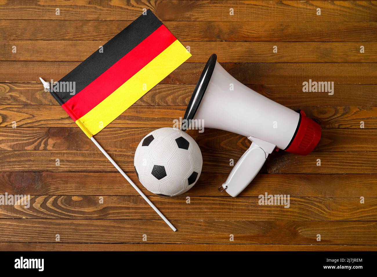 Flag of Germany, soccer ball and bullhorn on wooden background Stock ...