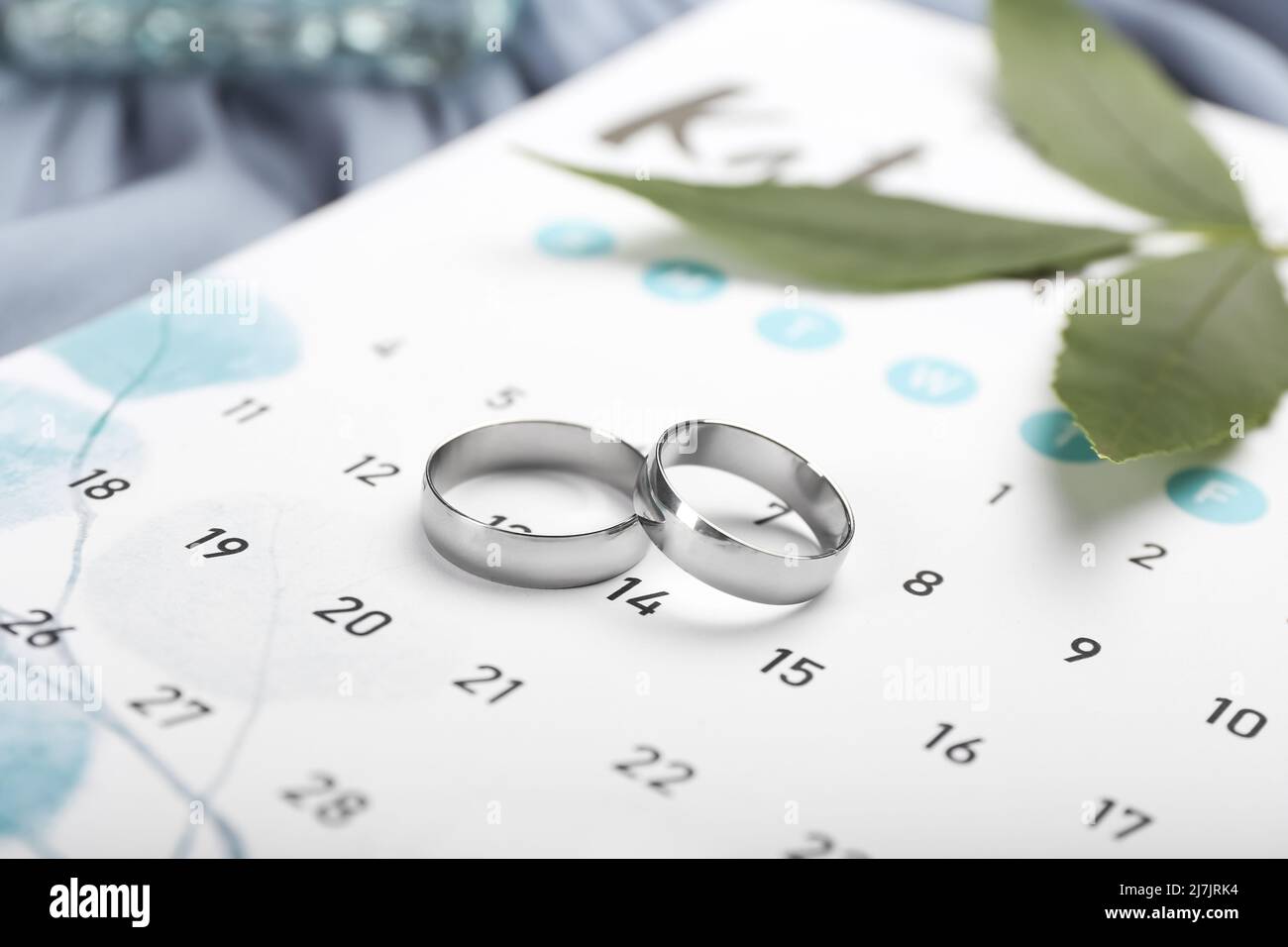 Wedding rings on calendar, closeup Stock Photo - Alamy
