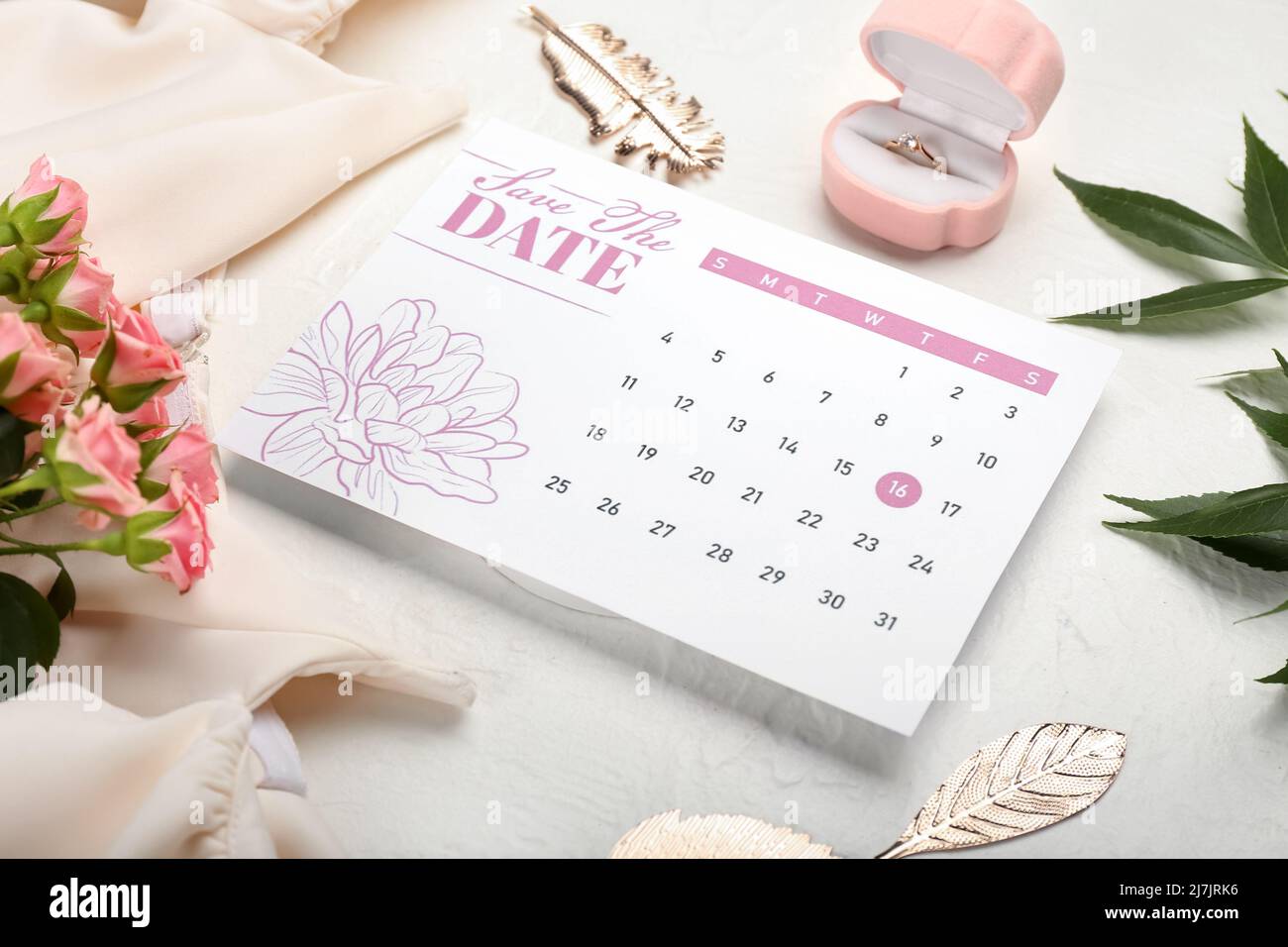 Wedding calendar with marked date, box with engagement ring and ...