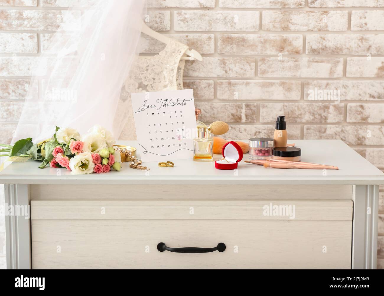 Wedding calendar with marked date, beautiful flowers and bridal ...